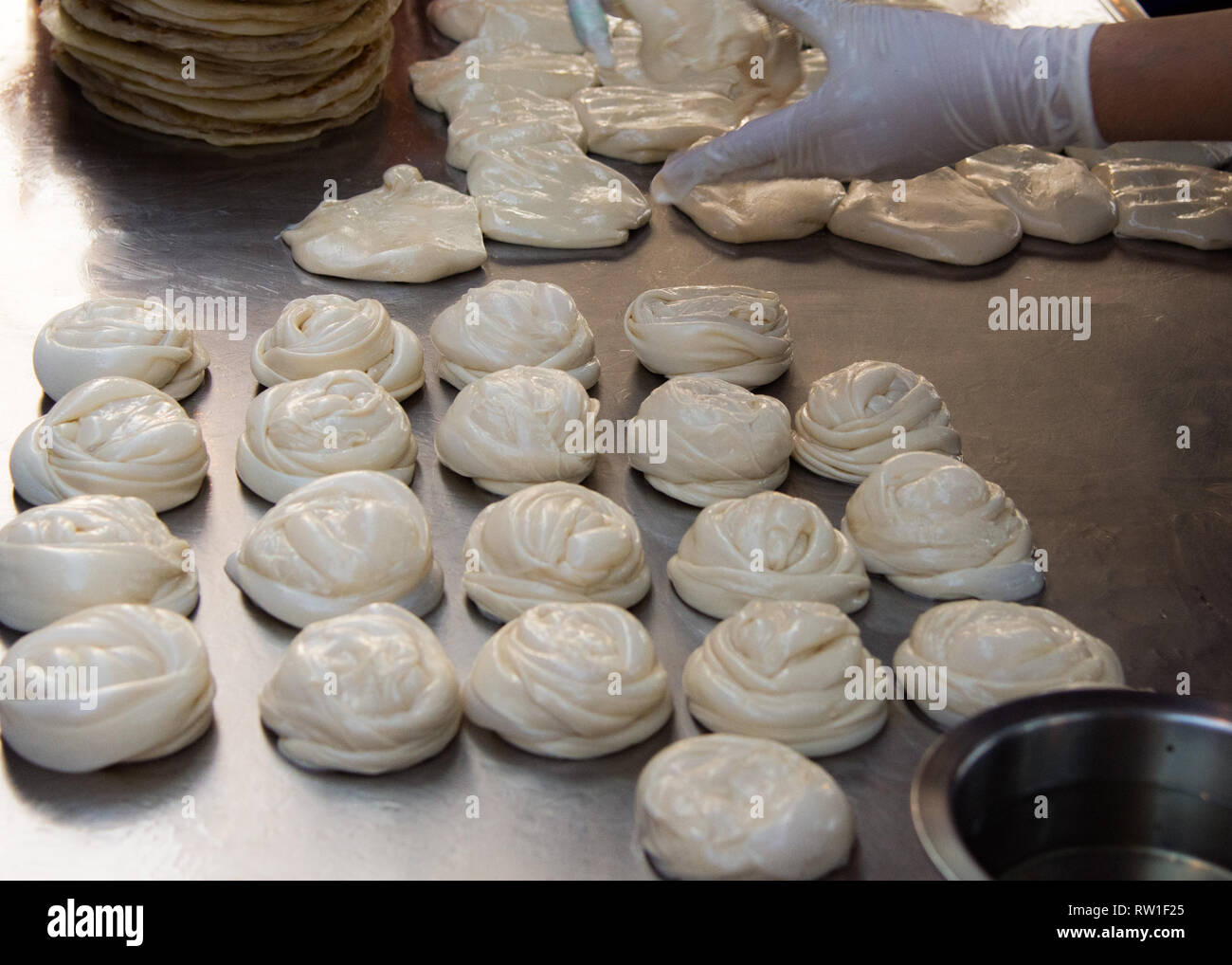 Making of Roti Canai, cooking process, Indian traditional street food ...