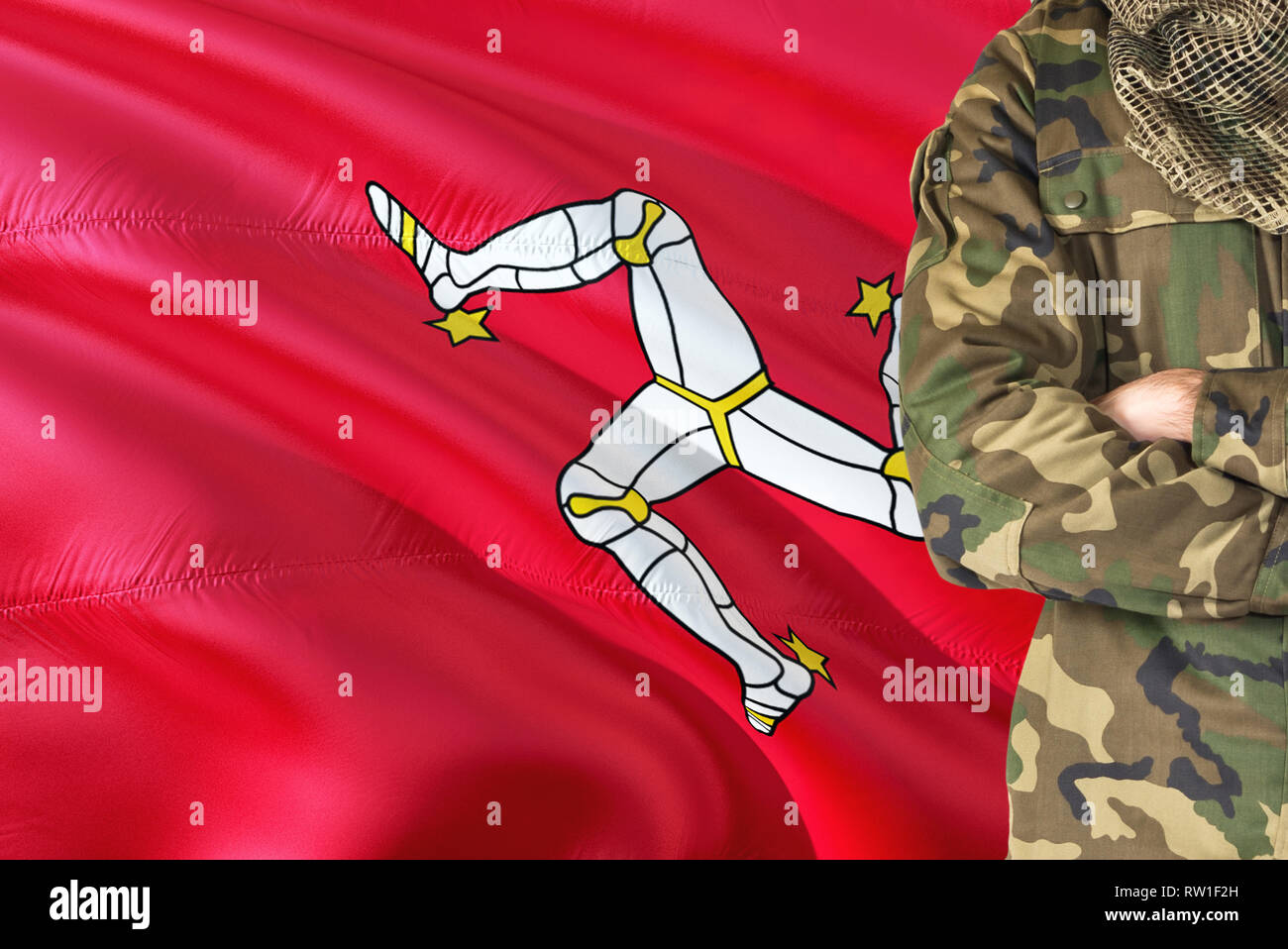 Crossed arms soldier with national waving flag on background - Isle Of ...