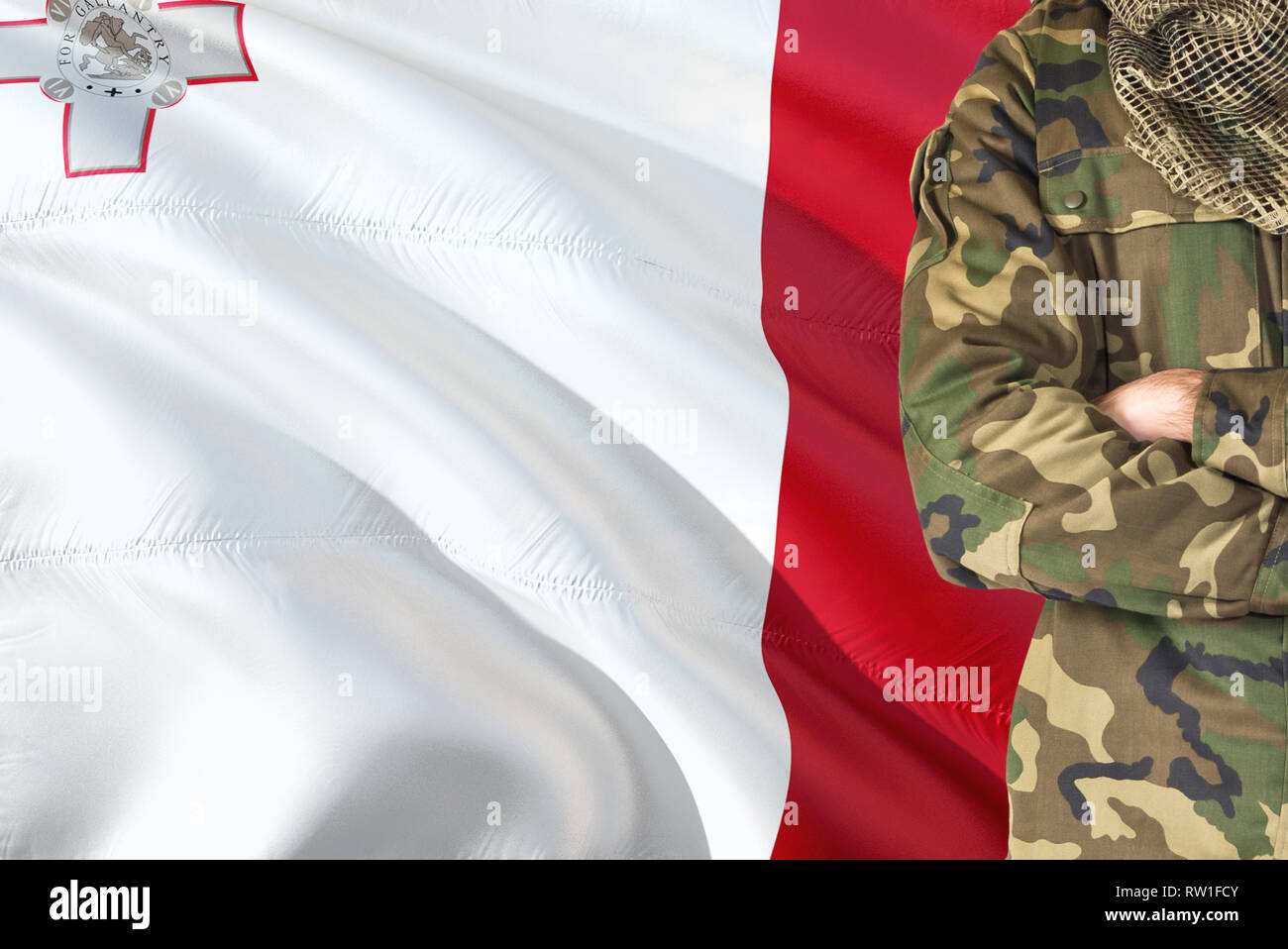 Crossed arms Maltese soldier with national waving flag on background ...