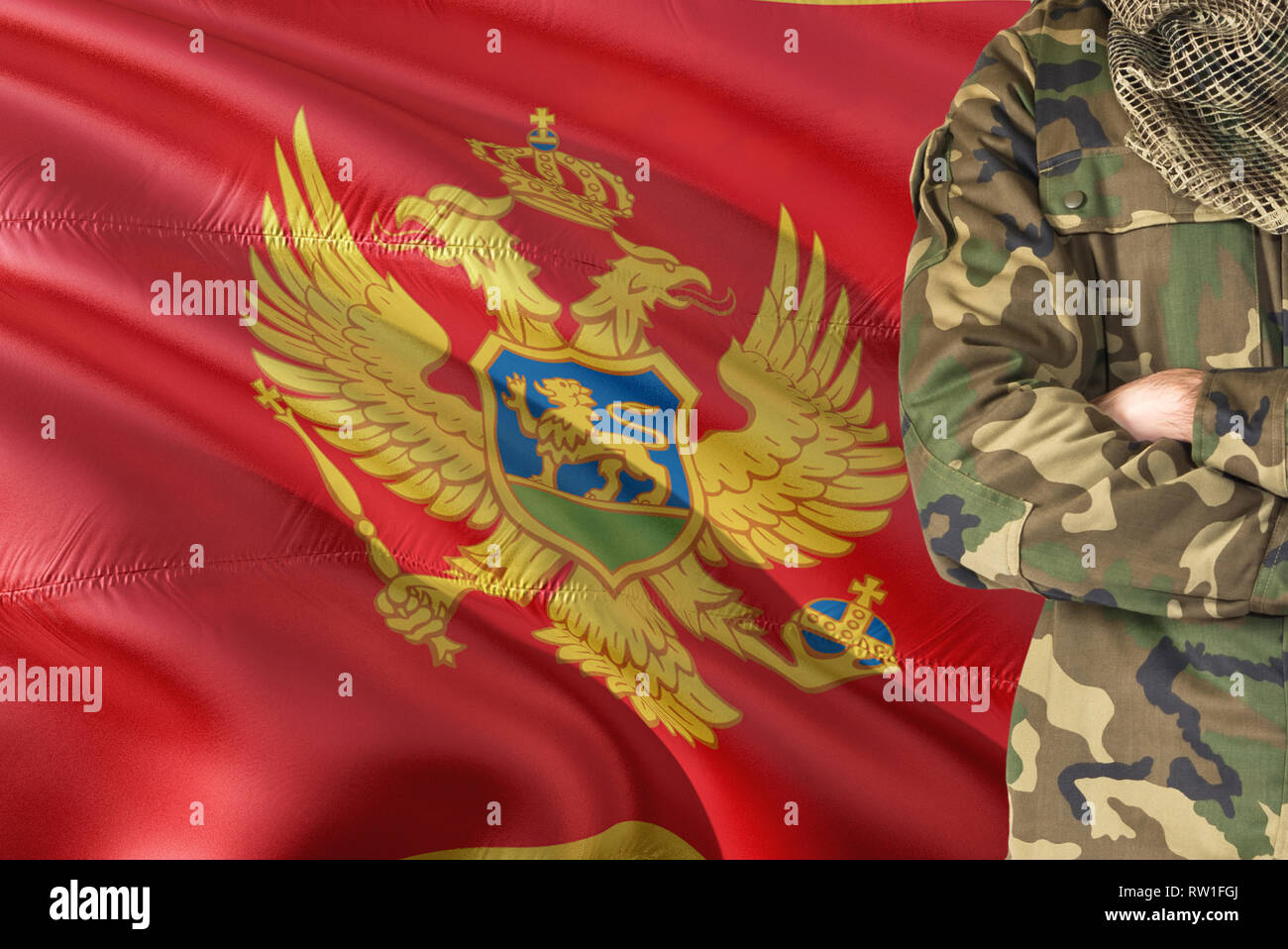 Crossed arms Montenegrin soldier with national waving flag on ...