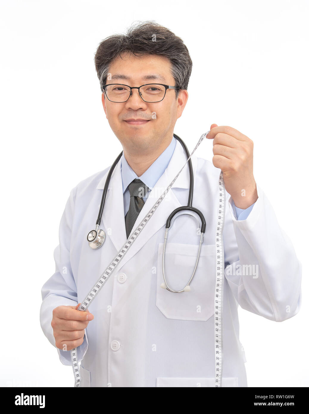 an Asian doctor with a tape measure in his hand. isolated on white ...