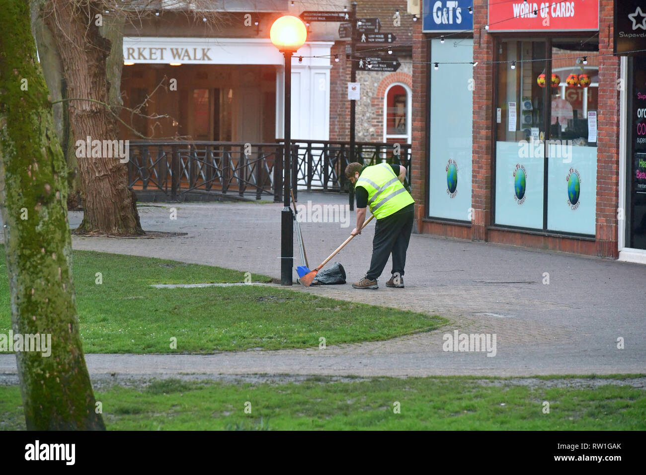 A man cleans the spot where former Russian spy Sergei Skripal and his ...
