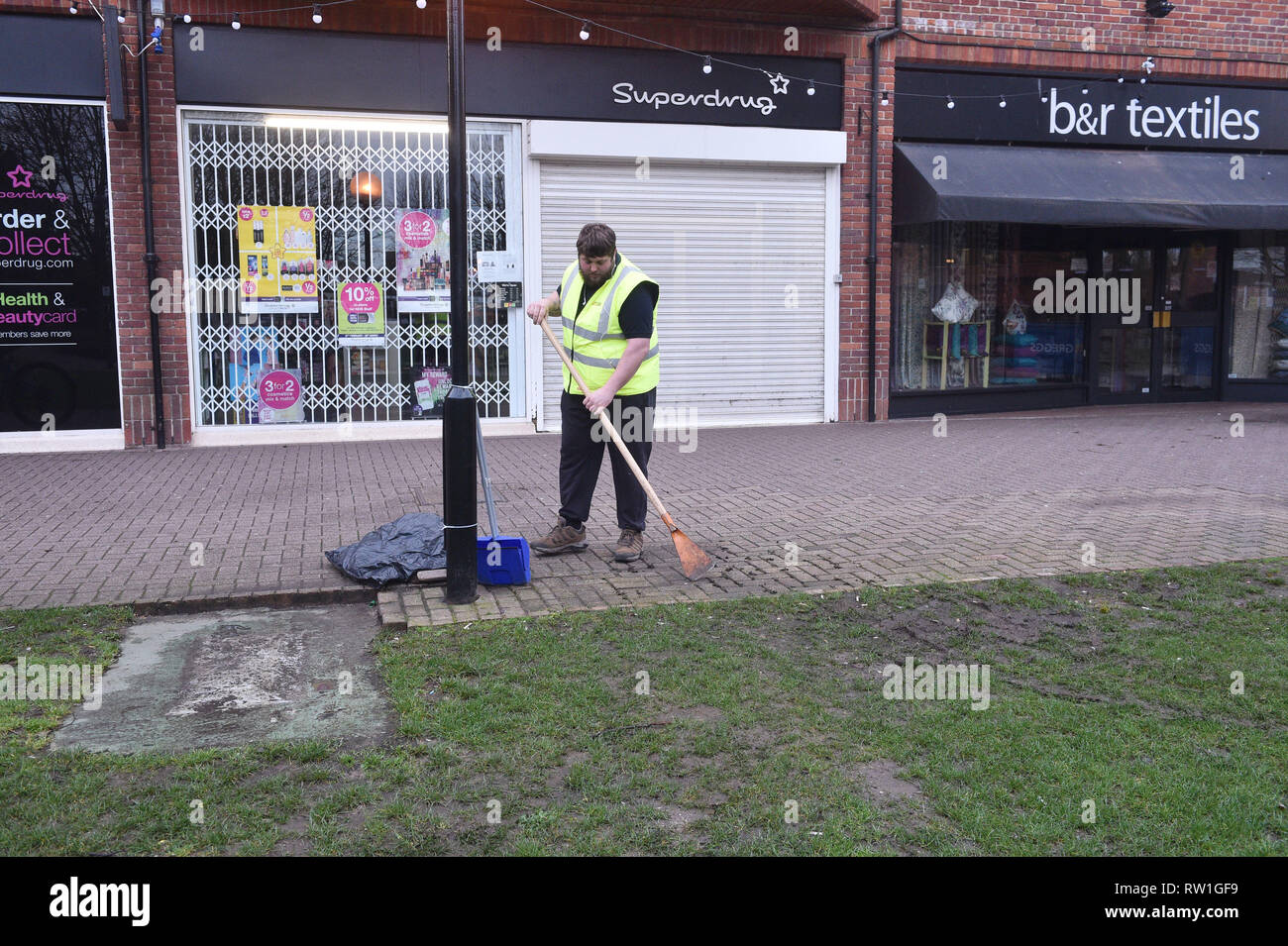 Retransmission: amends spelling of Skripal. A man cleans the spot where ...