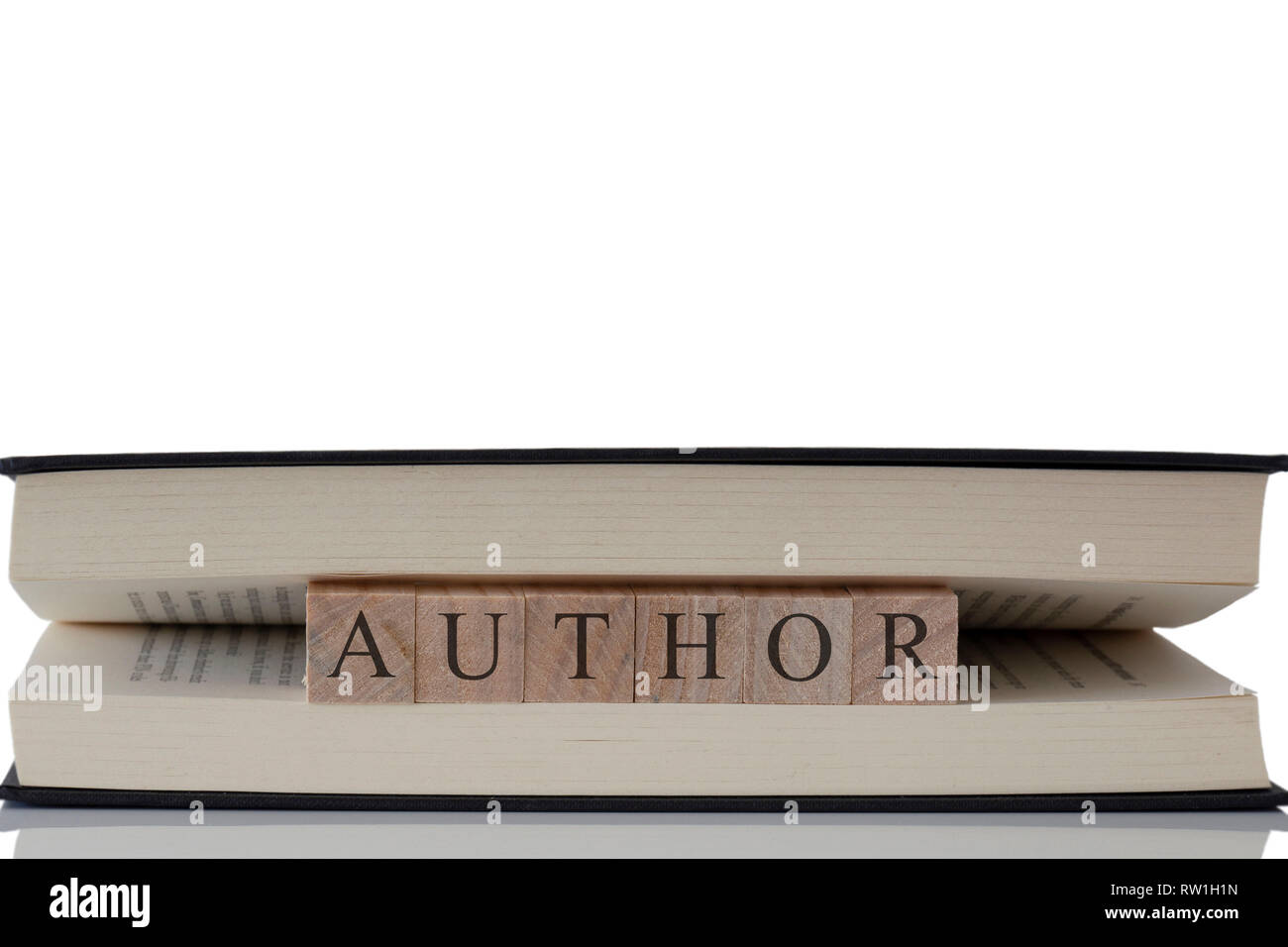 Author written on wooden blocks inside a book isolated on a white ...