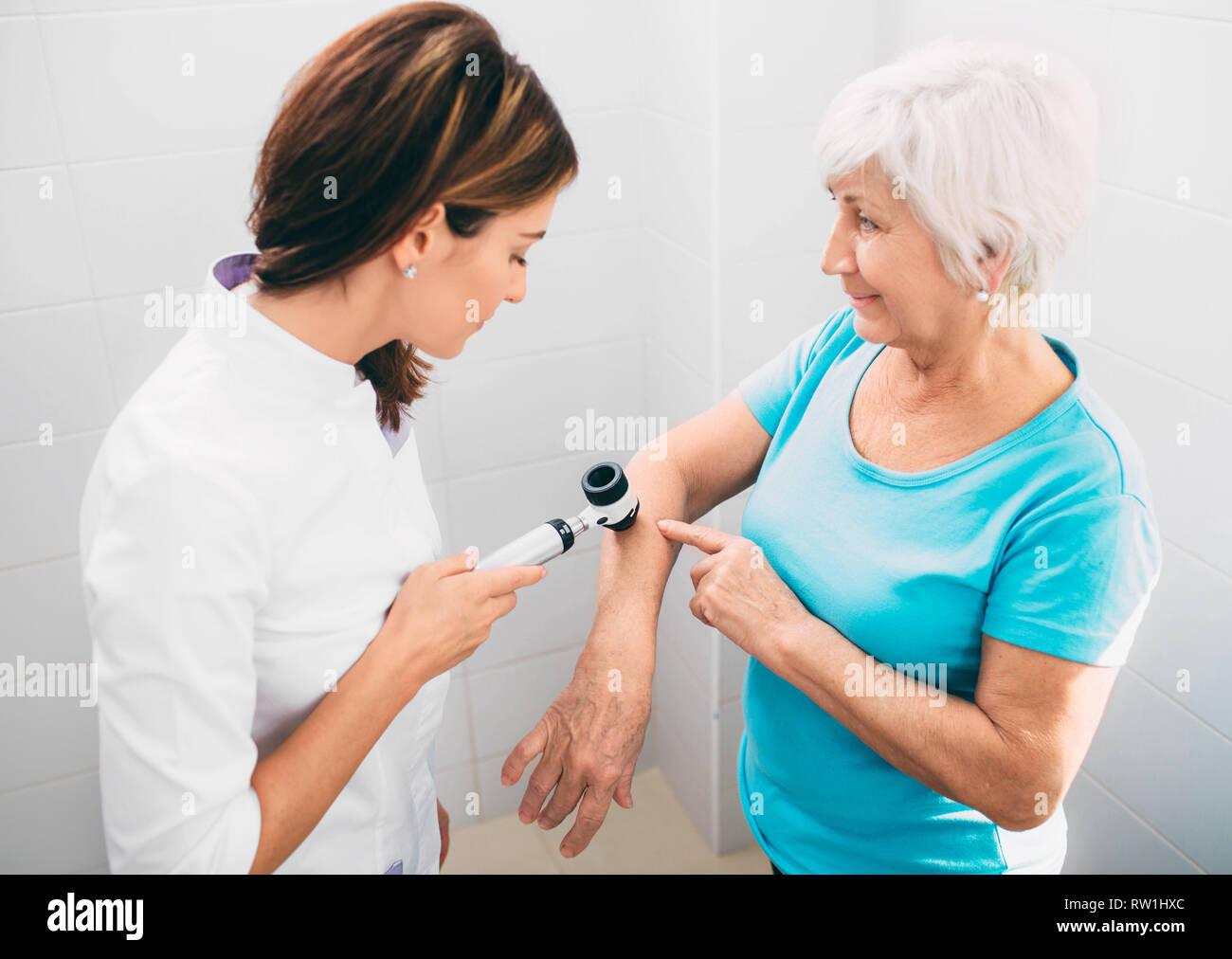 doctor examining patient skin moles with dermoscope Stock Photo - Alamy
