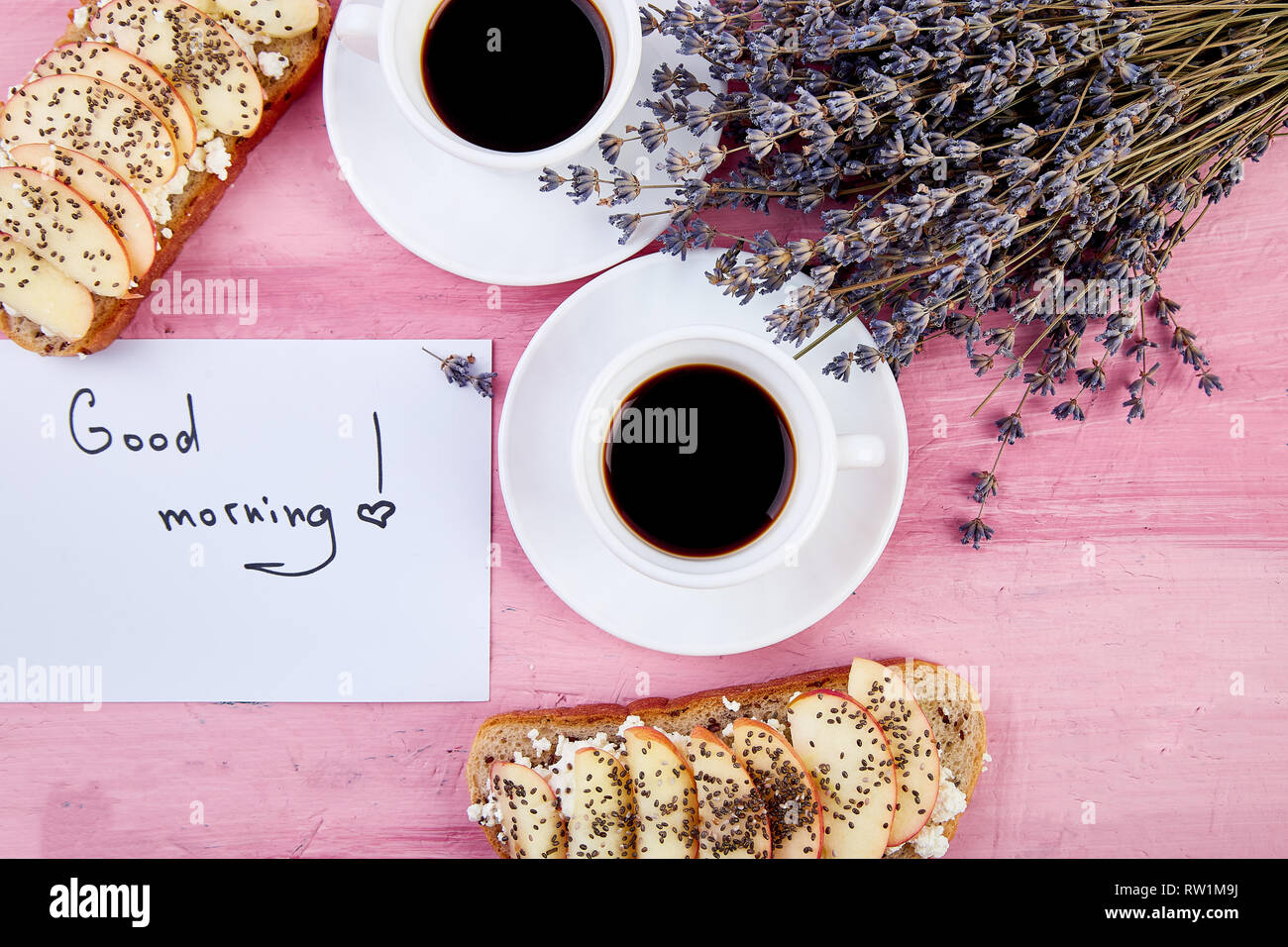 Two cups of coffee with bouquet of flowers lavender and healthy toasts ...