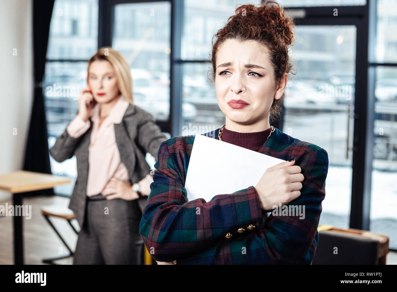 Accountant crying after job interview with strict businesswoman Stock ...