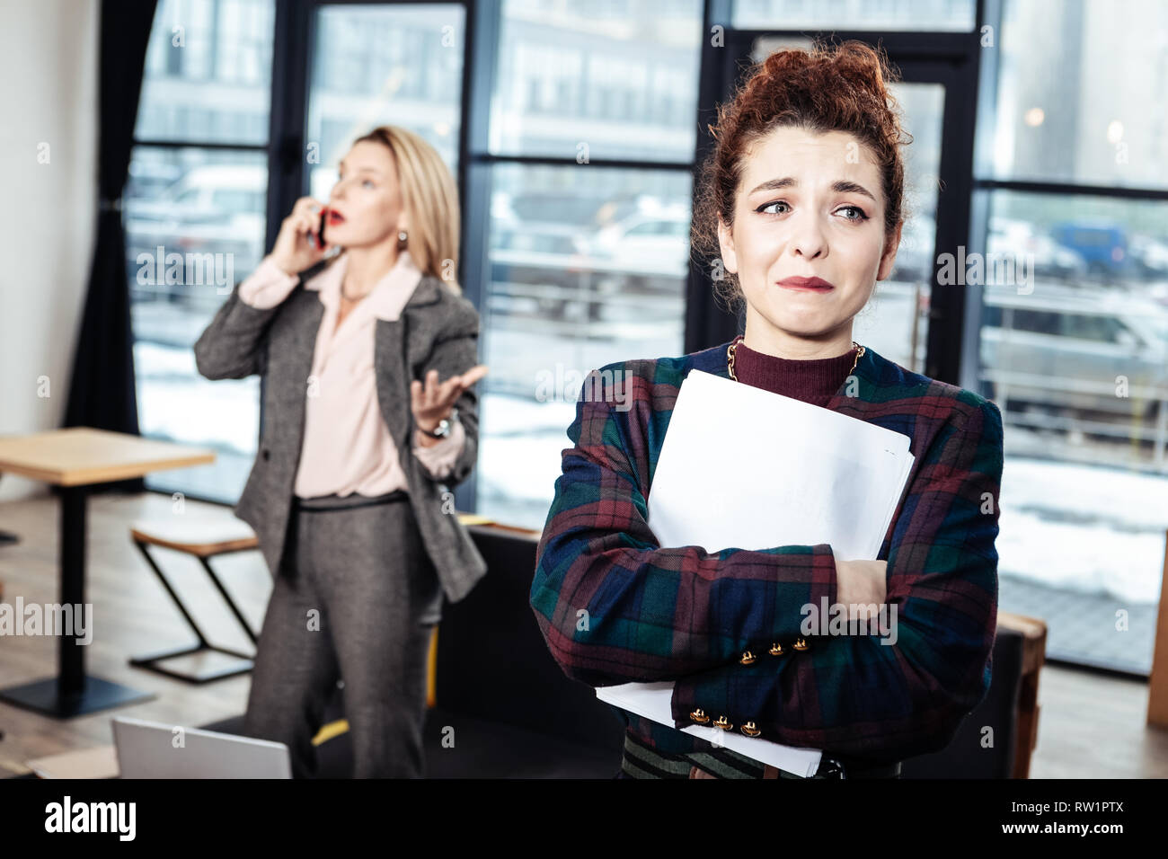 Secretary almost bursting into tears after awful job interview Stock ...