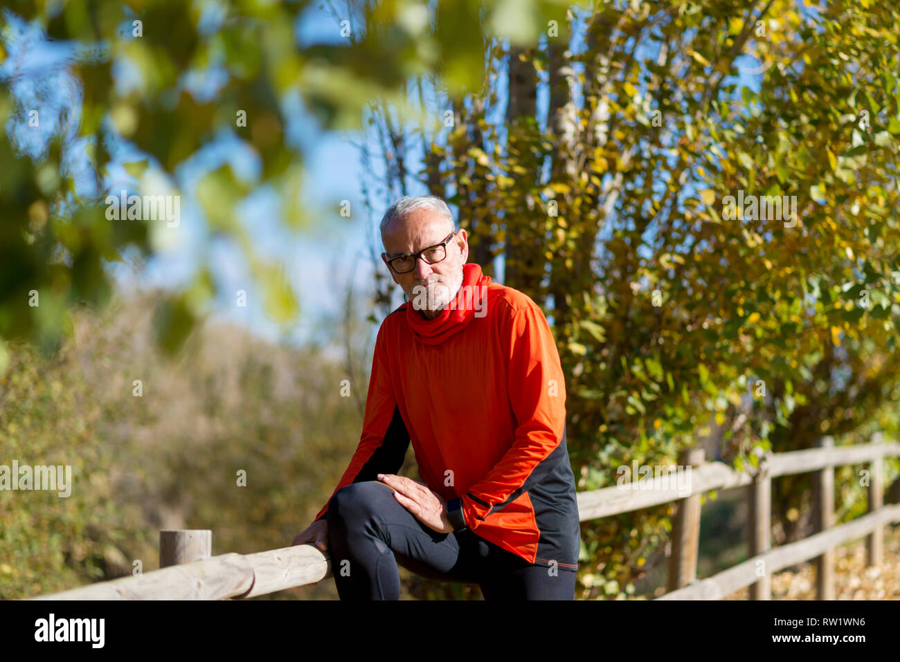 Man sitting on a fence hi-res stock photography and images - Alamy