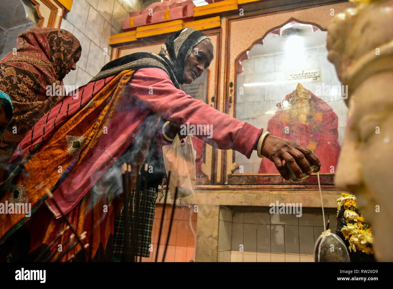March 4, 2019 - Srinagar, J&K, India - A Hindu devotee seen pouring ...