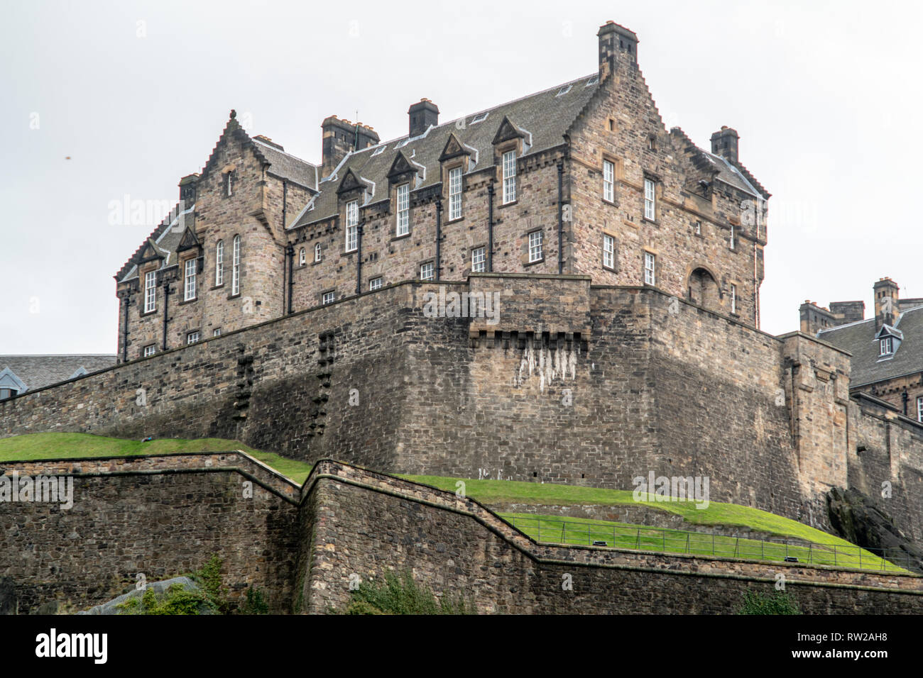The historic fortress of Edinburgh Castle sits on top of a hill ...