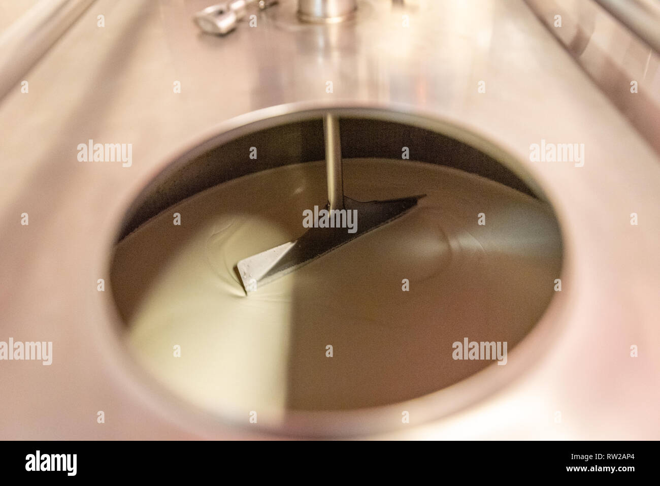 Inside of machine mixing cheese at dairy processing facility, Pokomoke ...