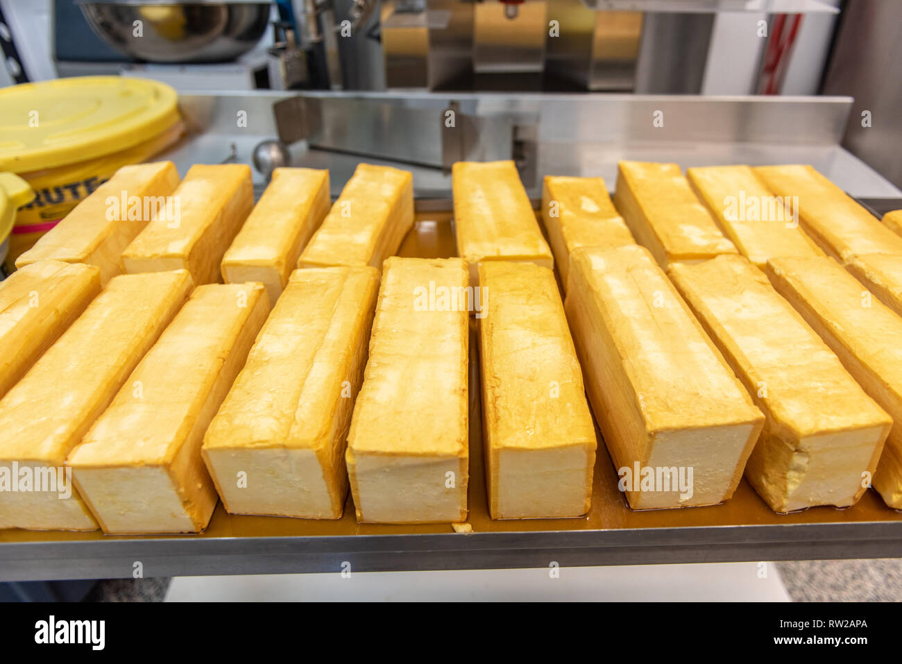 Blocks of freshly made cheese at dairy processing facility, Pokomoke ...