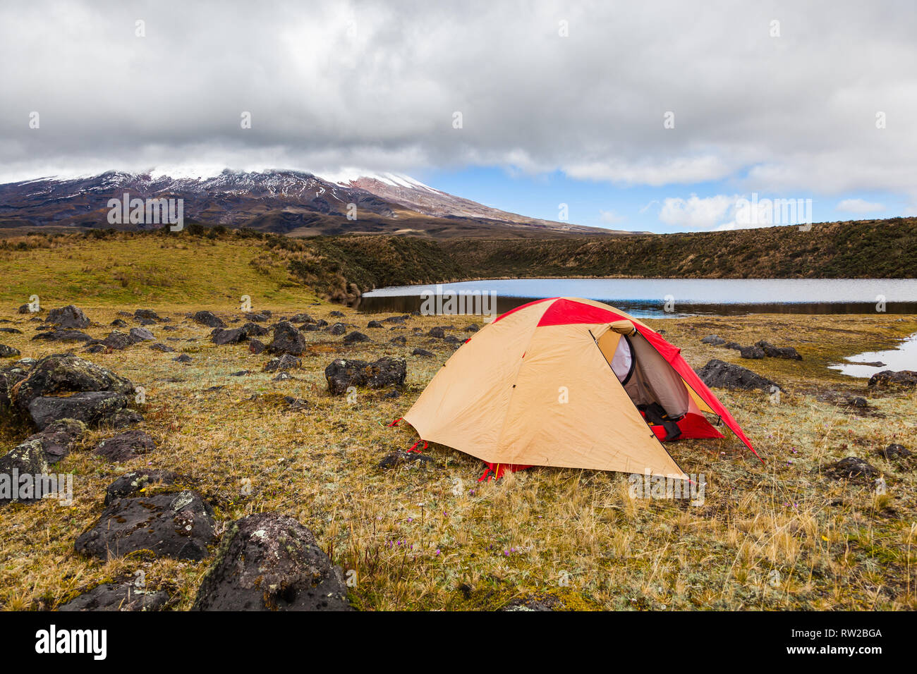 Tent on the shores of a lagoon and volcano Cotopaxi Stock Photo - Alamy