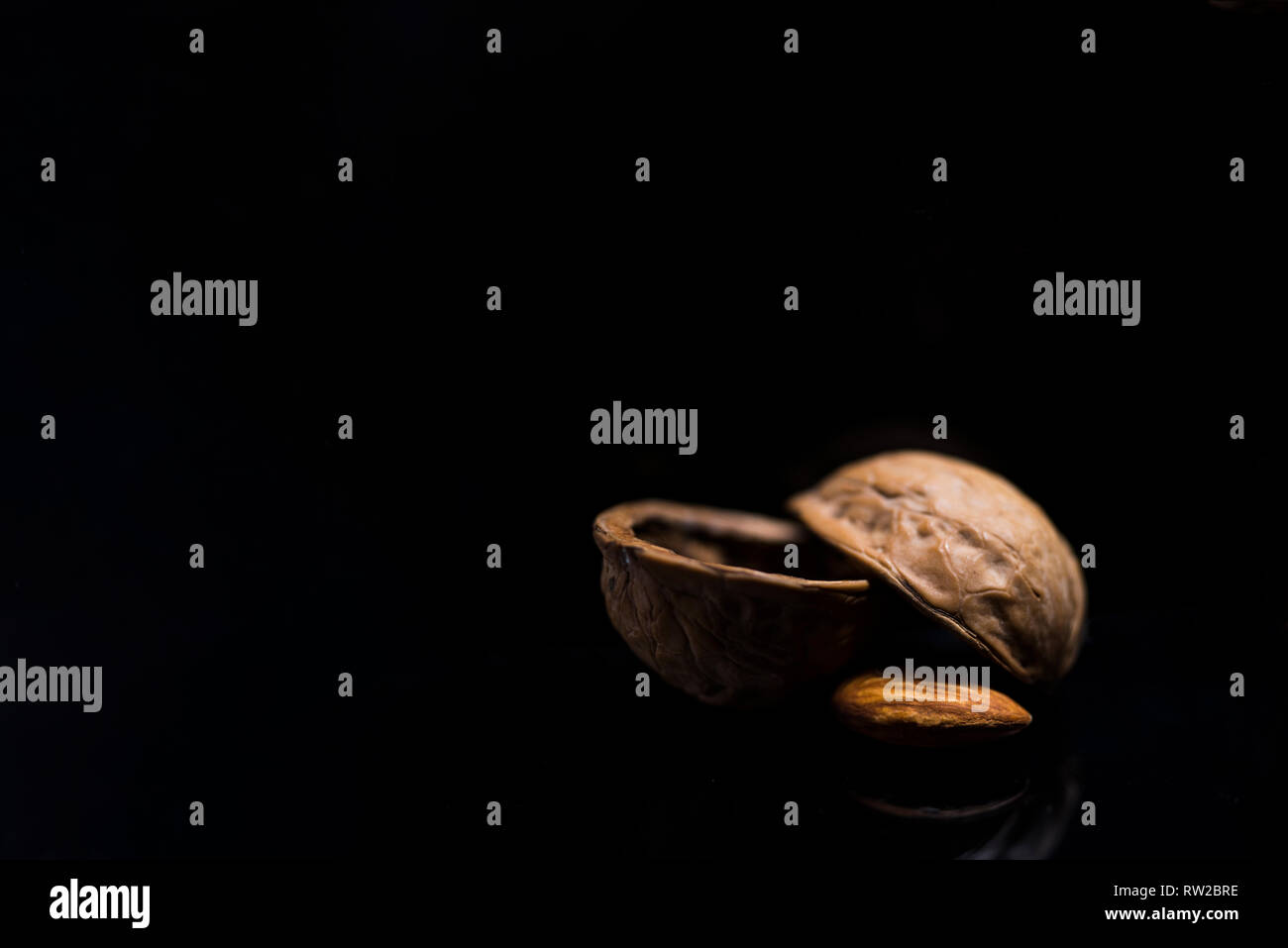 Isolate Dry Fruit with walnut shell from dark background Stock Photo ...