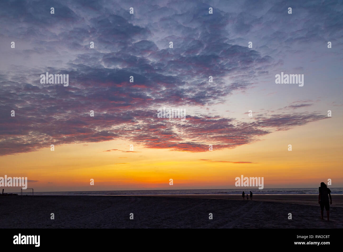 Beautiful sunset with clouds of various colors on the dark beach Stock ...