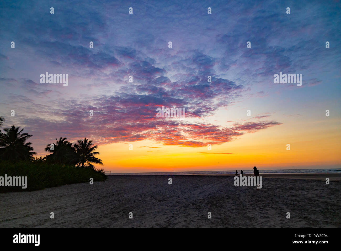 Beautiful sunset with clouds of various colors on the dark beach Stock ...