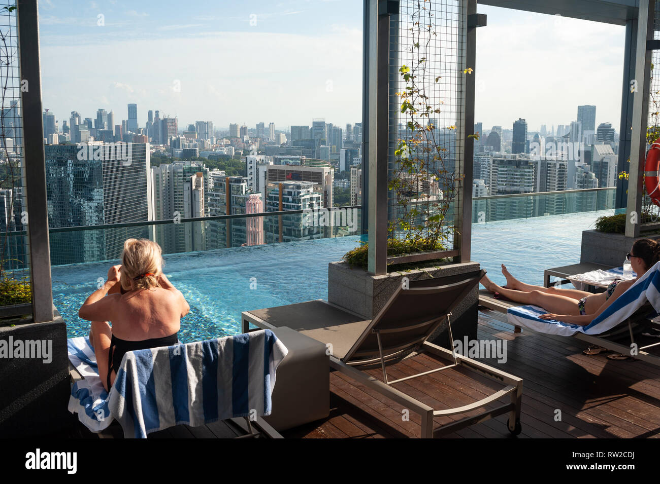 Woman sunbathing on rooftop hi-res stock photography and images - Alamy