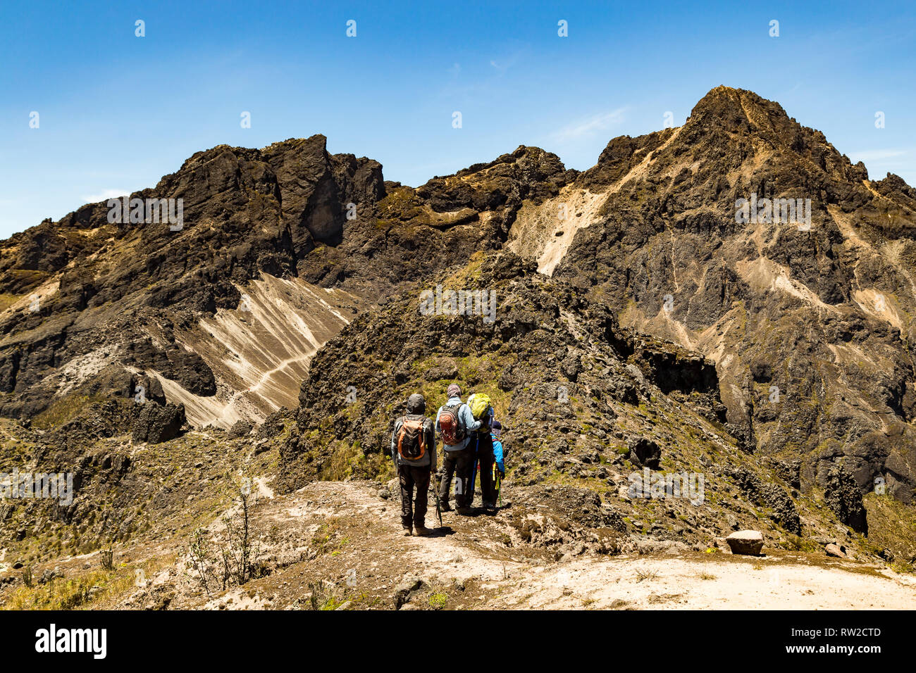 Group of climbers walking a path in the Pichincha Stock Photo - Alamy