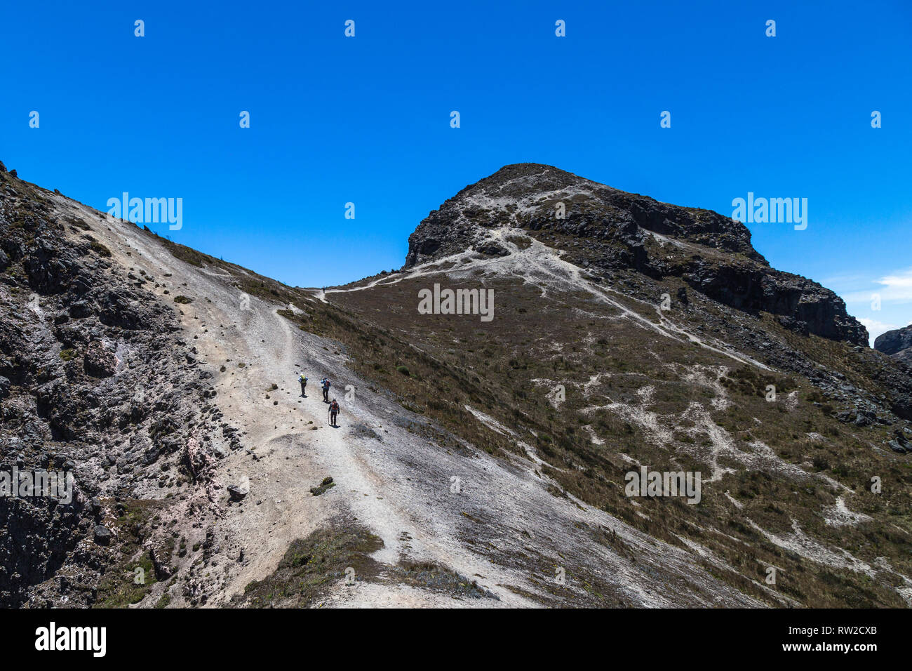 Group of climbers walking a path in the Pichincha Stock Photo - Alamy