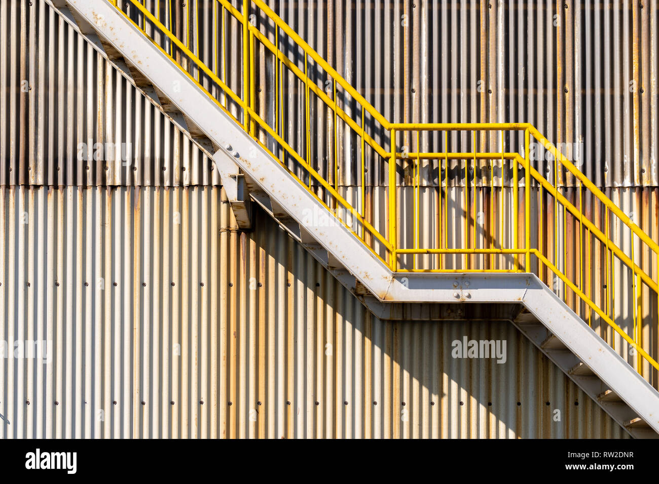 exterior of metal sheet warehouse wall and fire exit stair Stock Photo ...