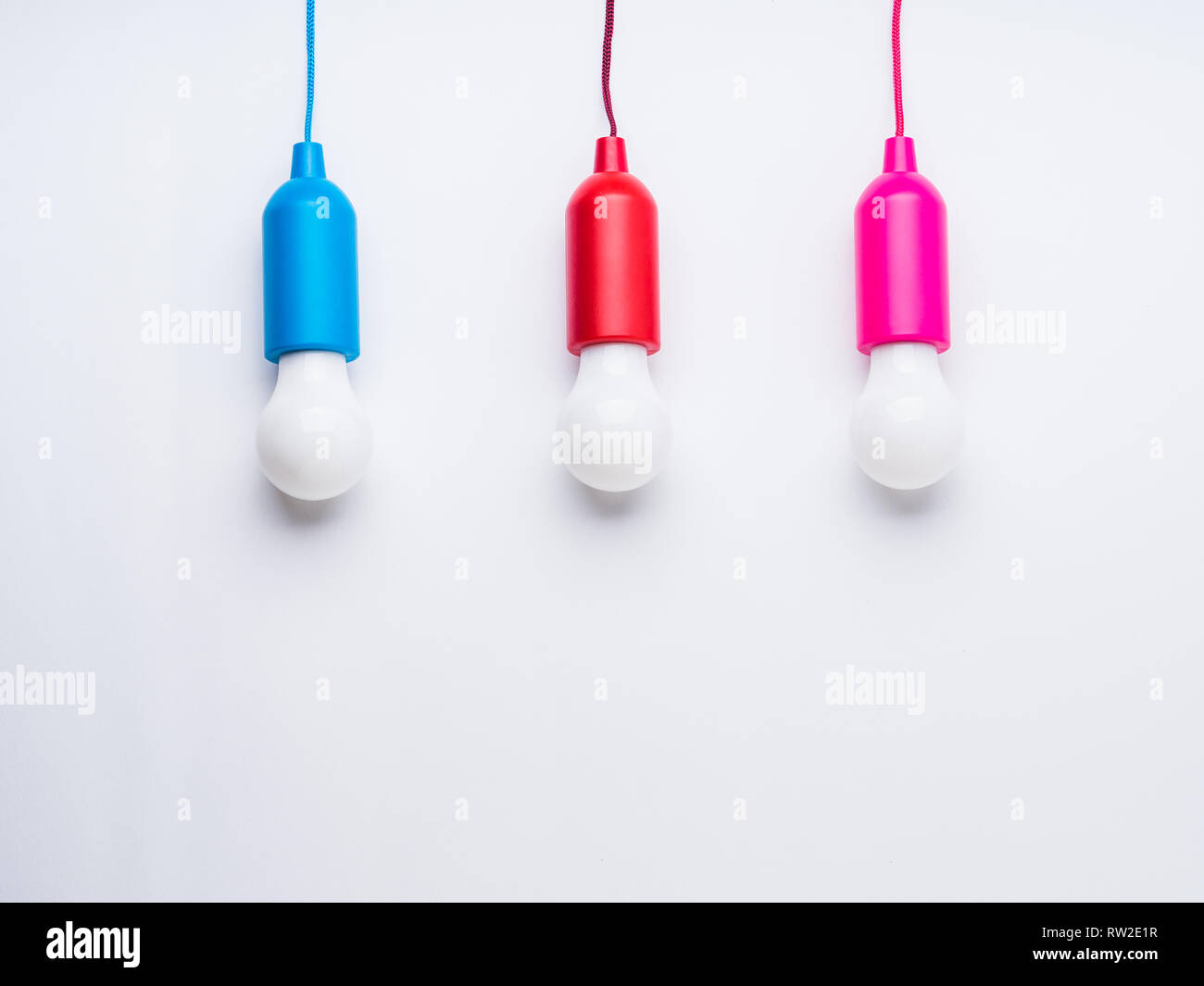 Three color light bulb lamps on white. Concept Stock Photo - Alamy