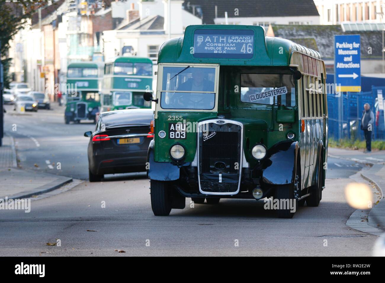 A cavalcade of 20 classic buses driving through Gloucester city centre ...