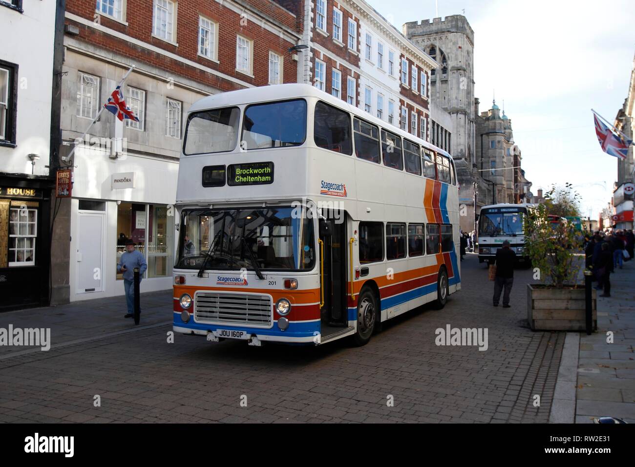 A cavalcade of 20 classic buses driving through Gloucester city centre ...
