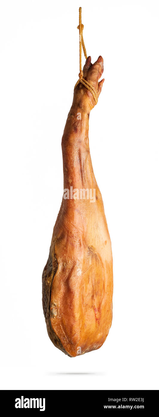 Whole leg of Spanish Iberian serrano ham hanging on a rope. Isolated on ...