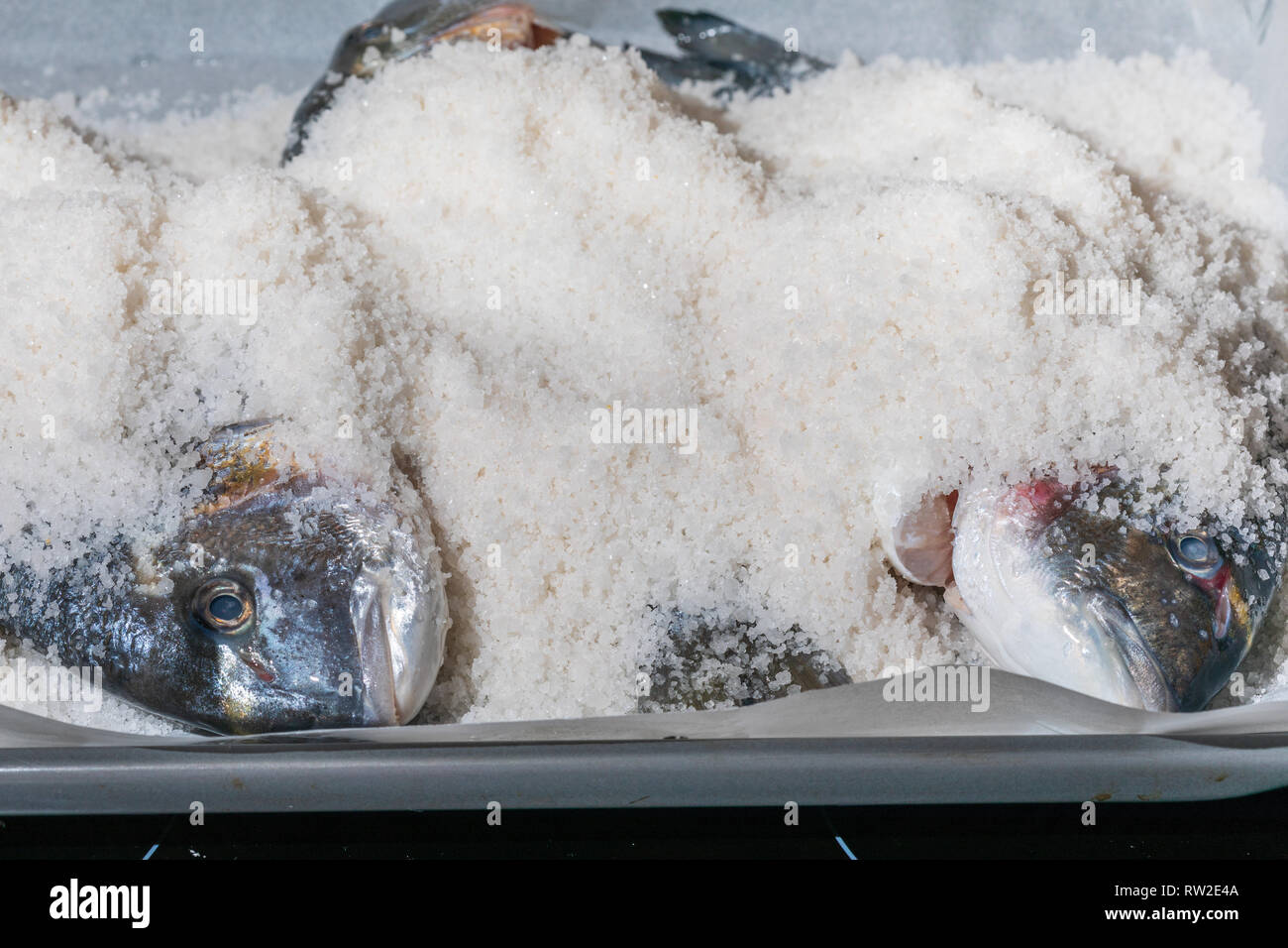 Dorada fish baked in salt hi-res stock photography and images - Alamy