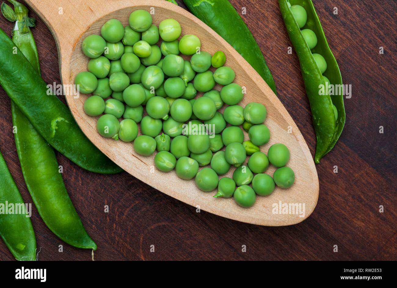 Green, tender, fresh and raw peas. Close-up and top view. Rustic ...