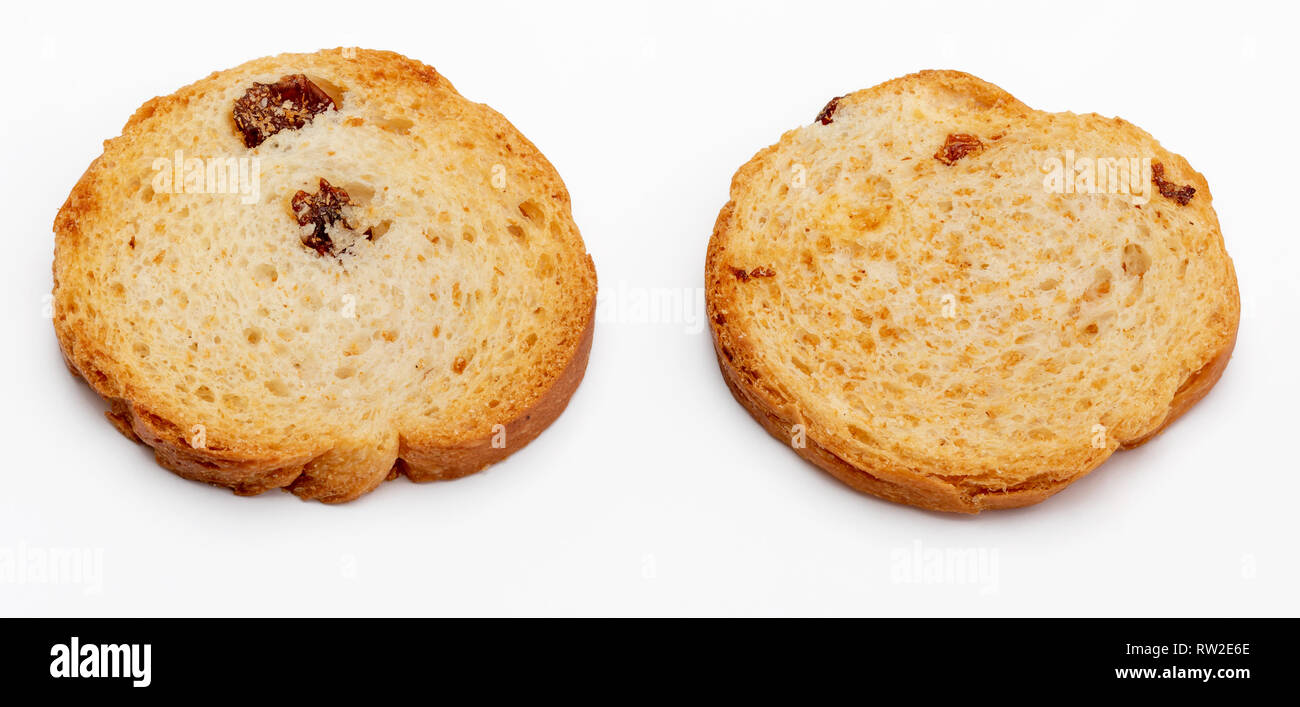 Mini round toasts of bread with raisins. 2 units. Isolated on white ...