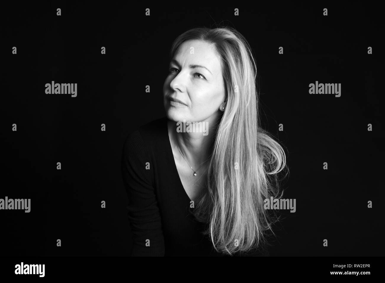 Black and white studio portrait of a beautiful woman in her 40s Stock ...