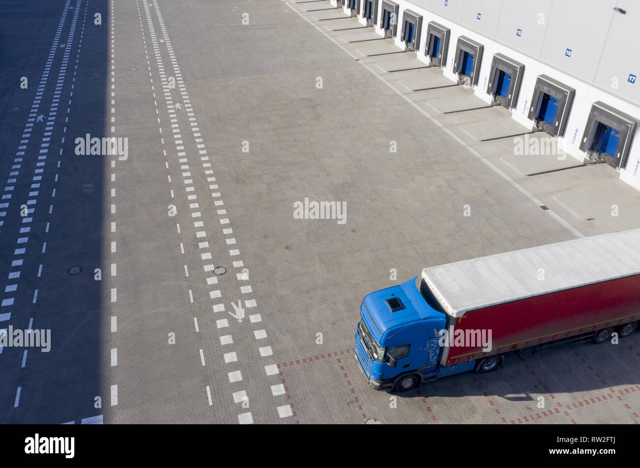 Aerial Shot of Industrial Warehouse Loading Dock, Truck with Semi ...
