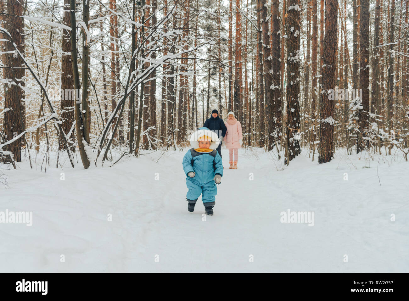 Walking family with a child. Family walks in nature in winter. Winter ...