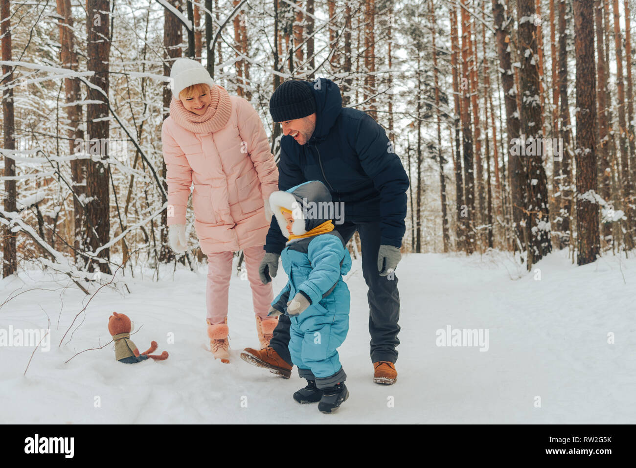 Walking family with a child. Family walks in nature in winter. Winter ...