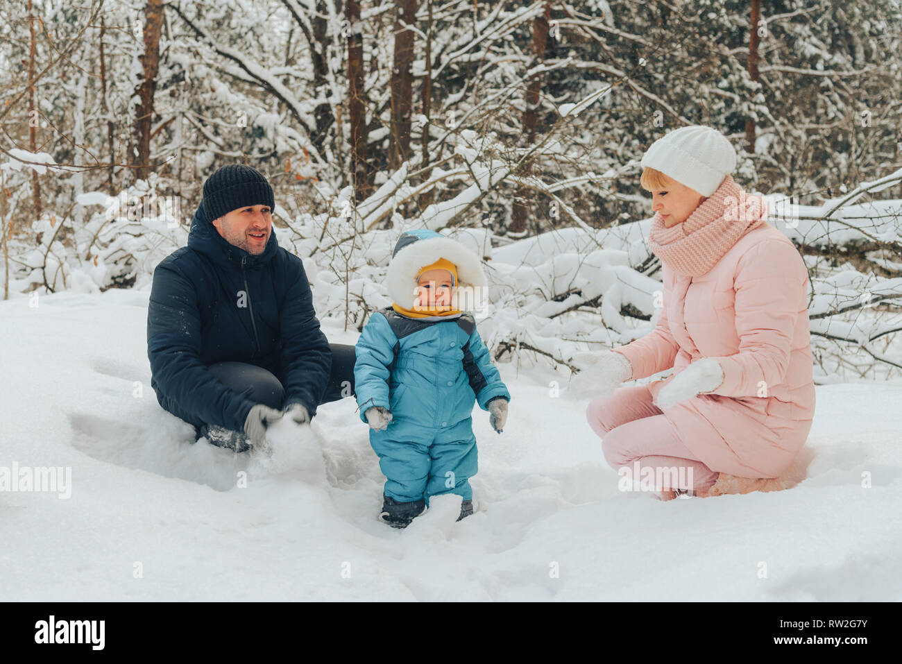 Walking family with a child. Family walks in nature in winter. Winter ...