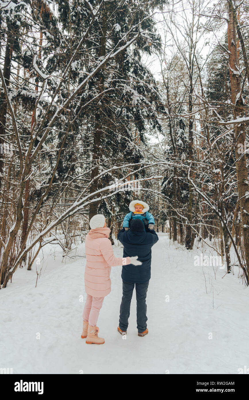 Walking family with a child. Family walks in nature in winter. Winter ...