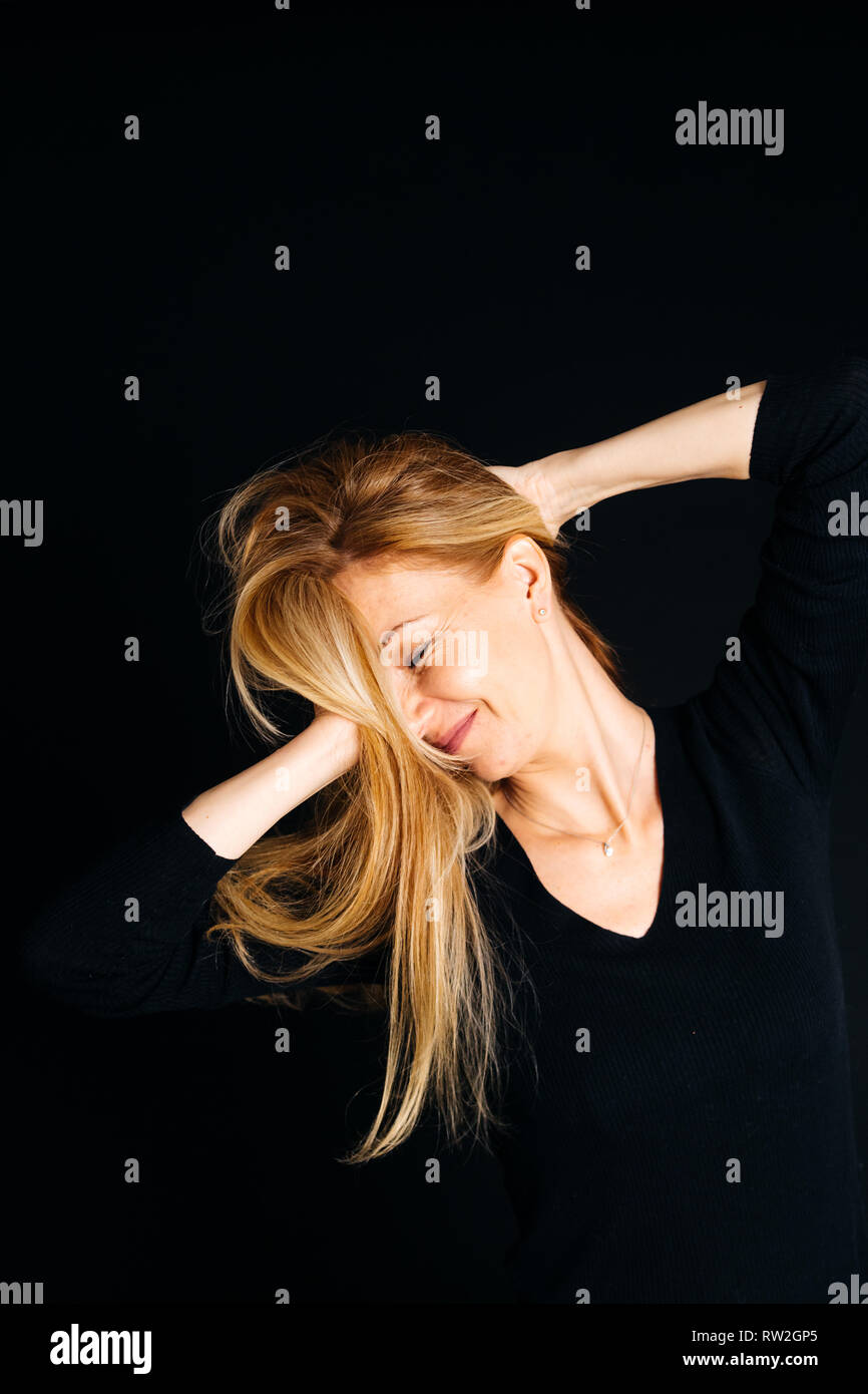 Close up studio portrait of a beautiful woman in the black dress ...