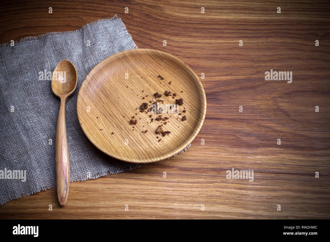 Fasting, Lent. Plate with spoon and crumb on wooden background Stock ...