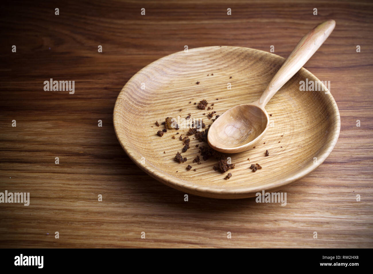 Fasting, Lent. Plate with spoon and crumb on wooden background Stock ...