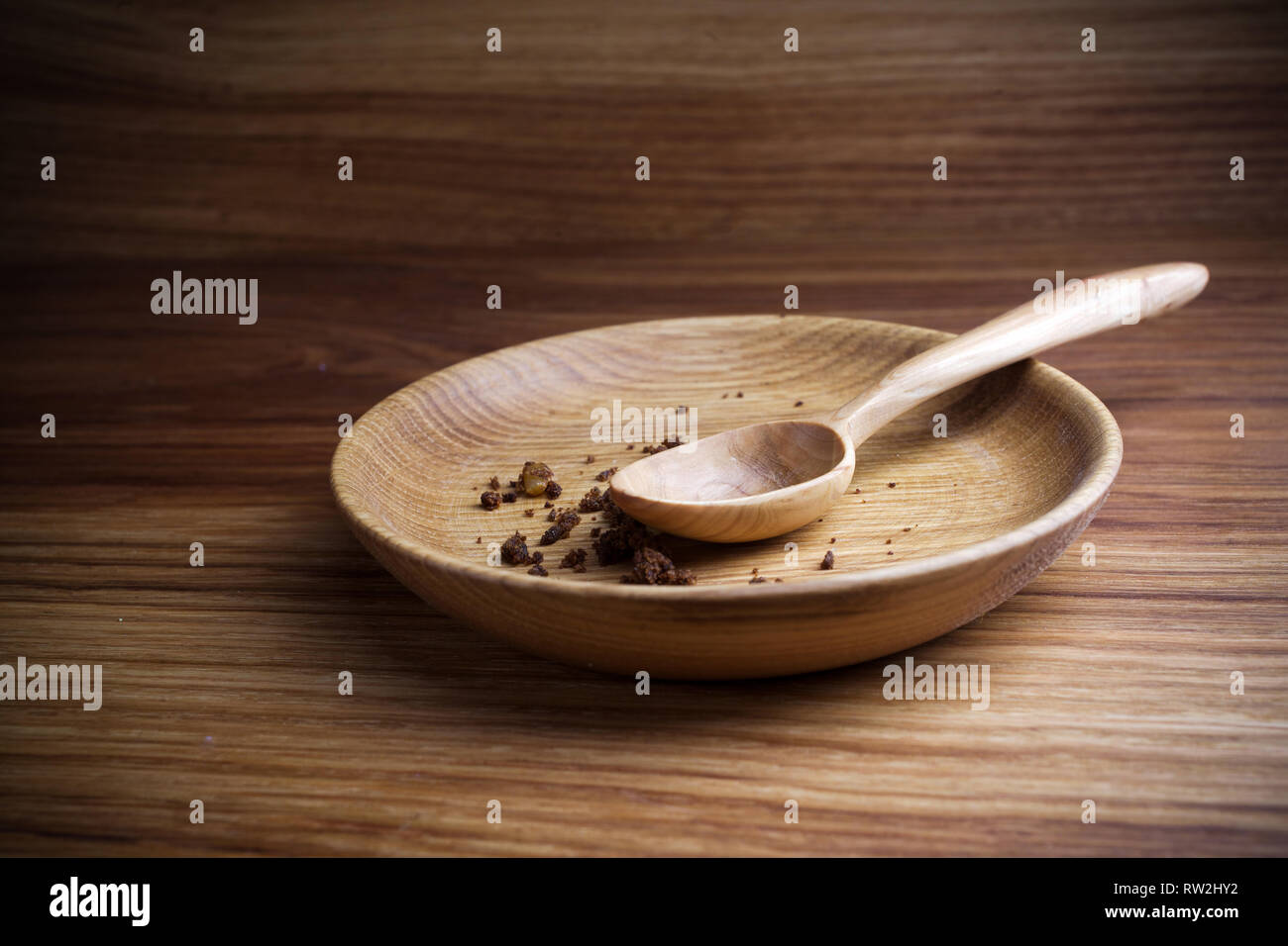 Fasting, Lent. Plate with spoon and crumb on wooden background Stock ...
