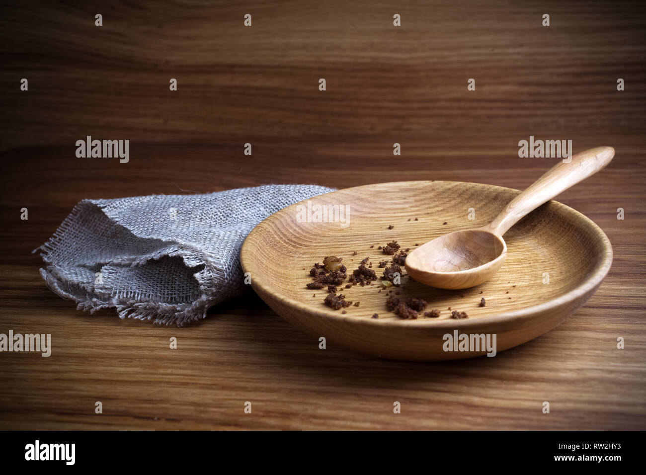Fasting, Lent. Plate with spoon and crumb on wooden background Stock ...