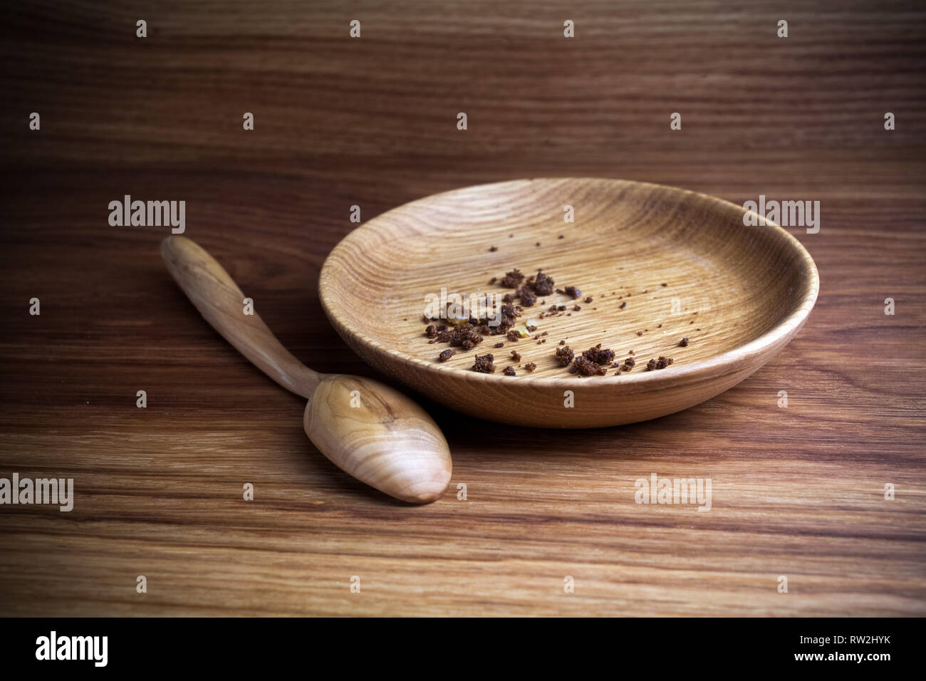 Fasting, Lent. Plate with spoon and crumb on wooden background Stock ...
