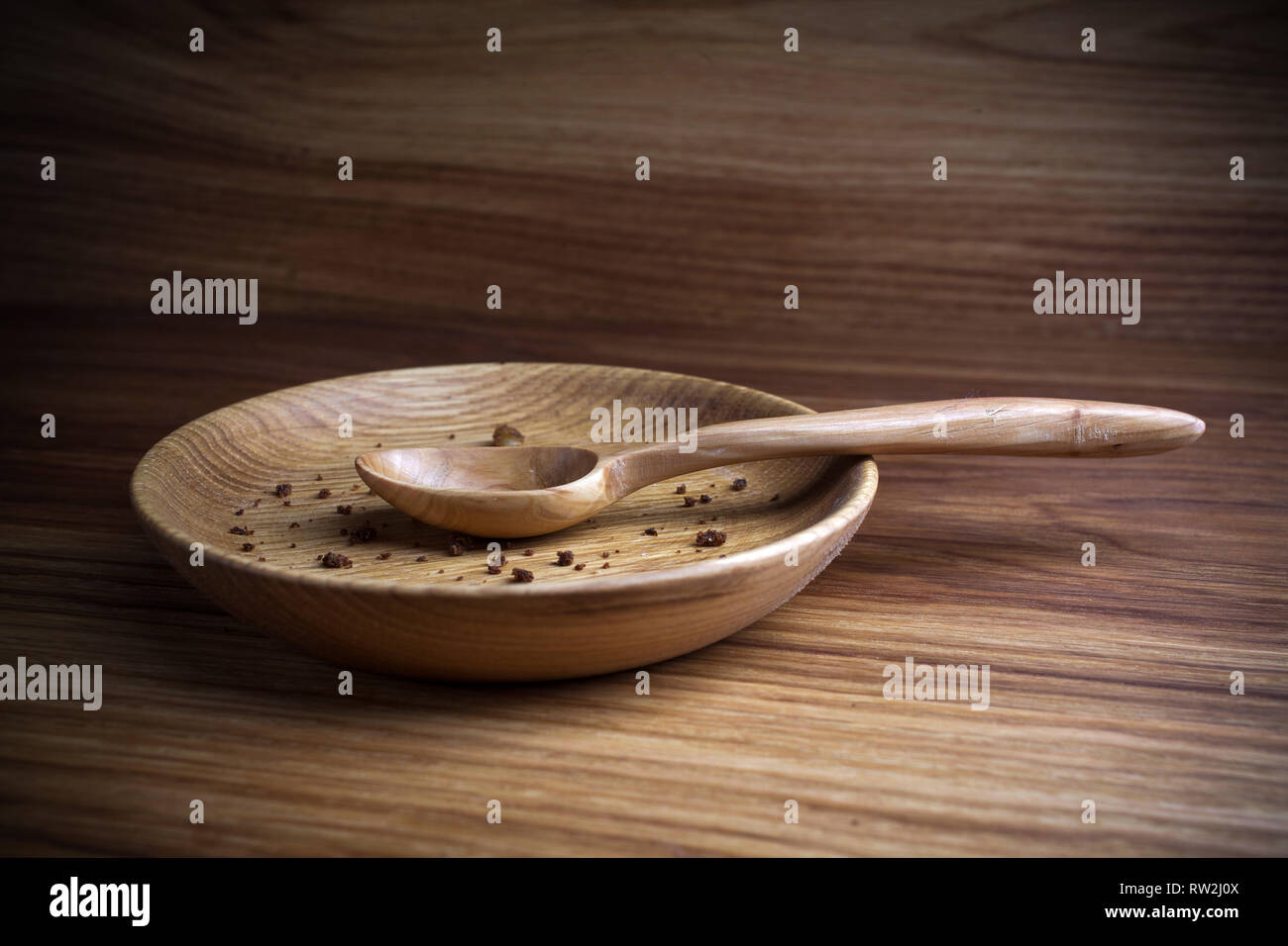 Fasting, Lent. Plate with spoon and crumb on wooden background Stock ...