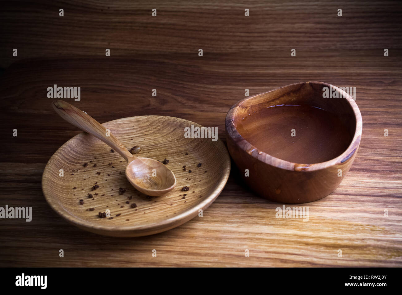 Fasting, Lent. Plate with spoon and cup of water on wooden background ...
