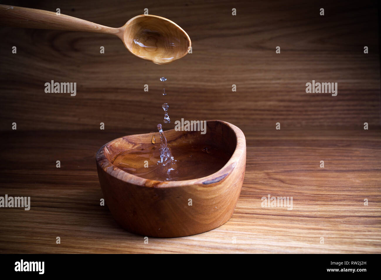 Fasting, Lent. Spoon and cup of water on wooden background Stock Photo ...