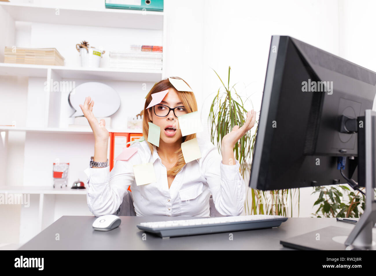 confused business woman with sticky notes on her face Stock Photo - Alamy