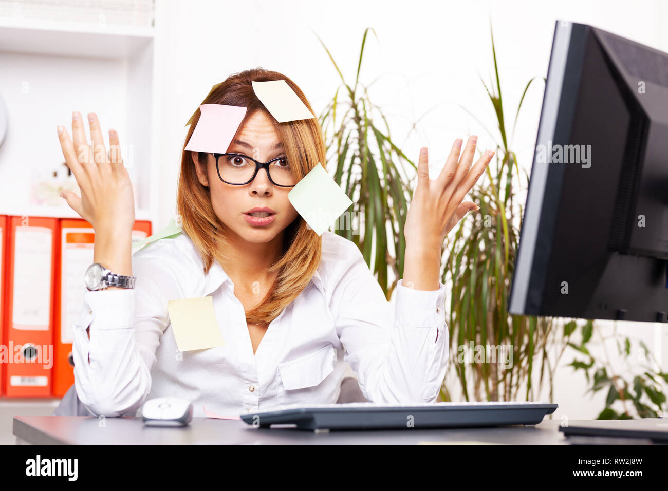 confused business woman with sticky notes on her face Stock Photo - Alamy