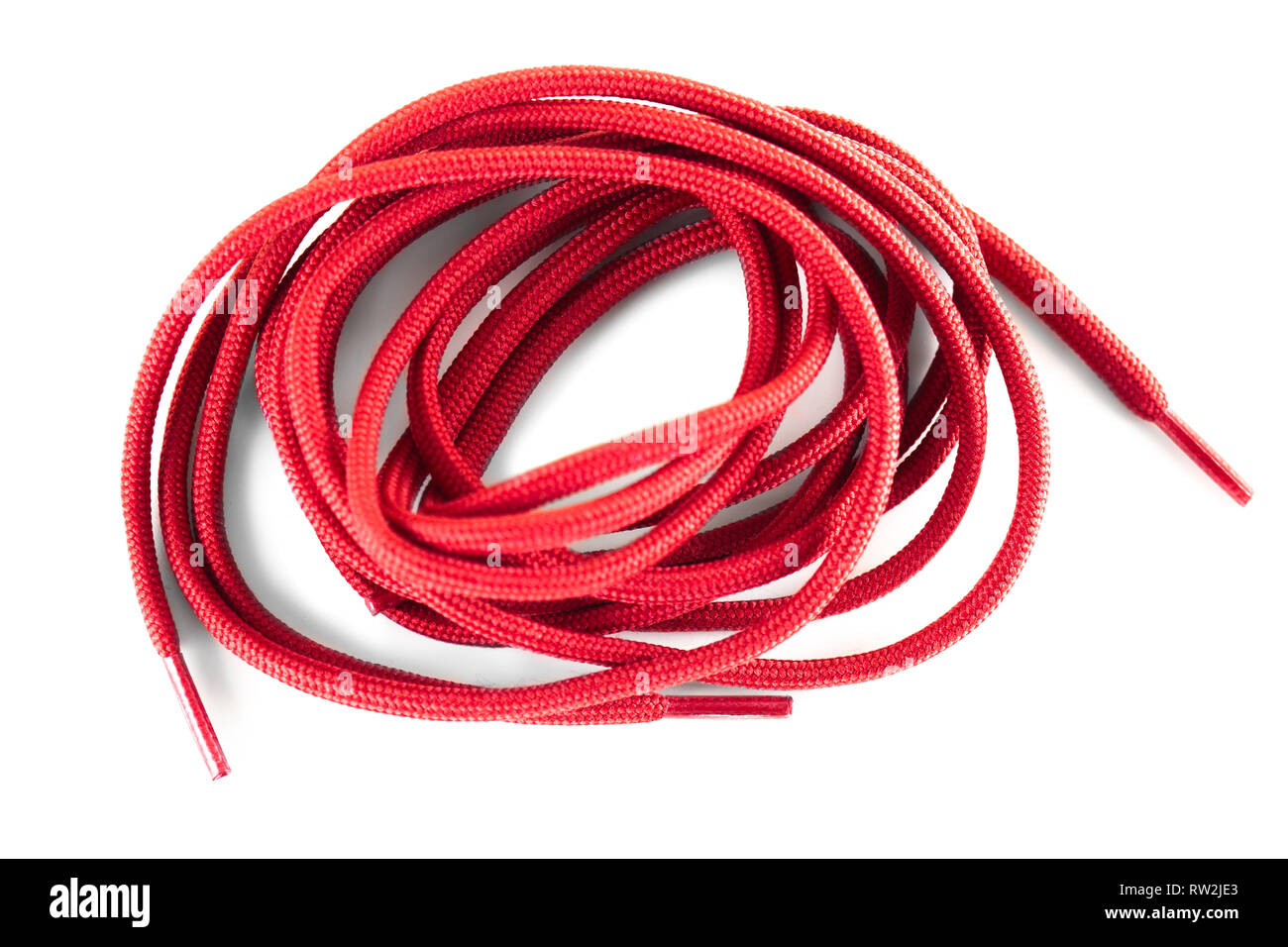 red shoe laces against white background Stock Photo - Alamy